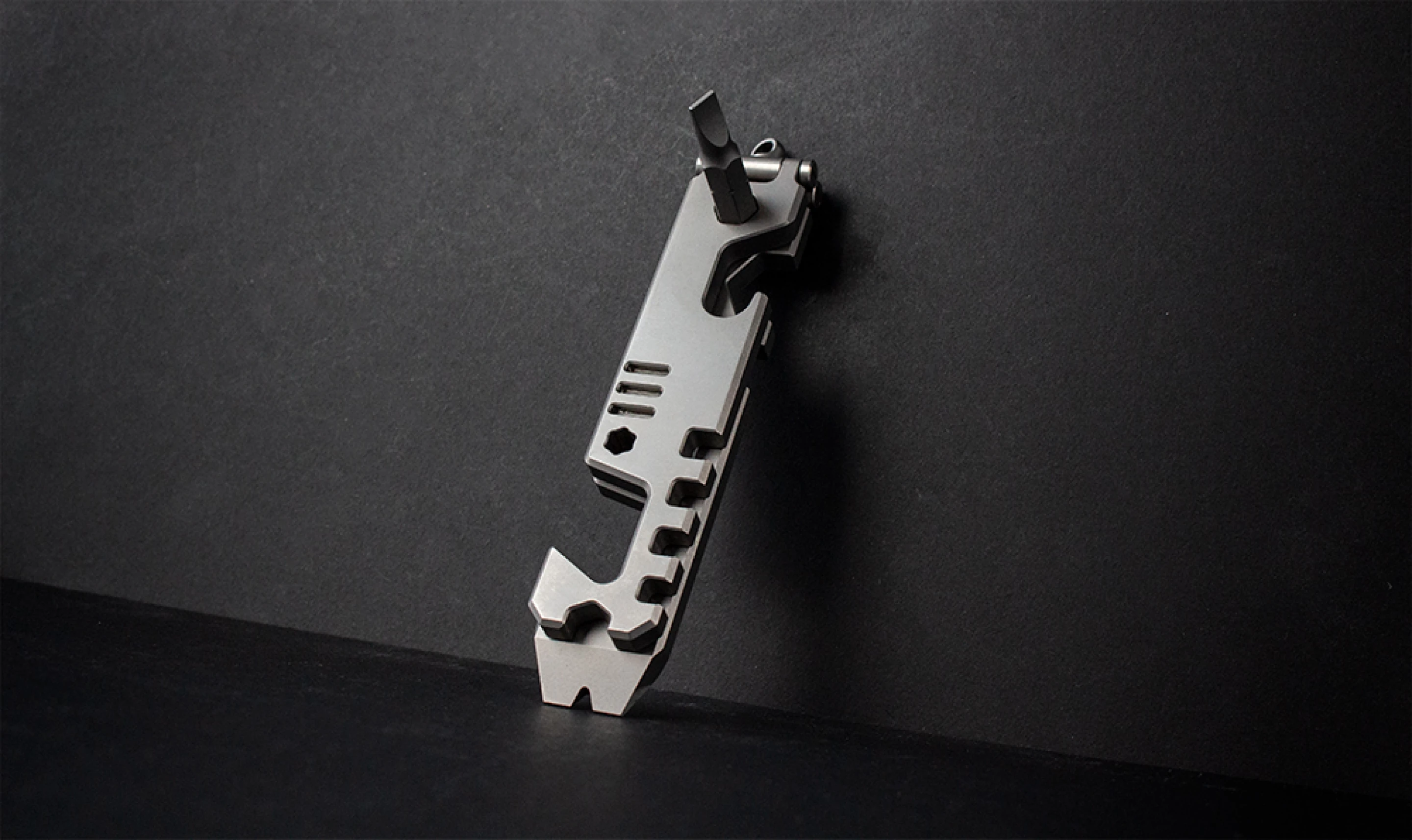 Fire-starting titanium multitool with device stand smashes goals