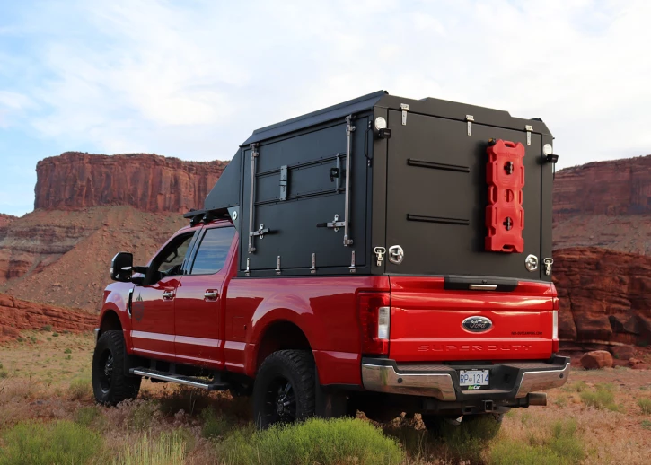 Expandable pickup camper canopy spreads its wings to sleep the family