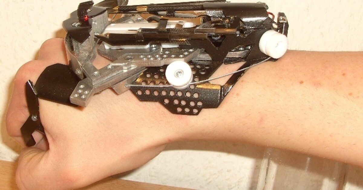 Hobbyist builds wrist-mounted, laser-sighted crossbow