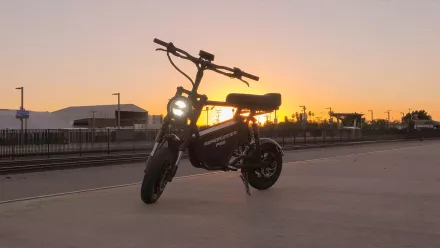 Roadrunner Pro seated e-scoot rides with 1,800-Wh battery and 4-kW motors