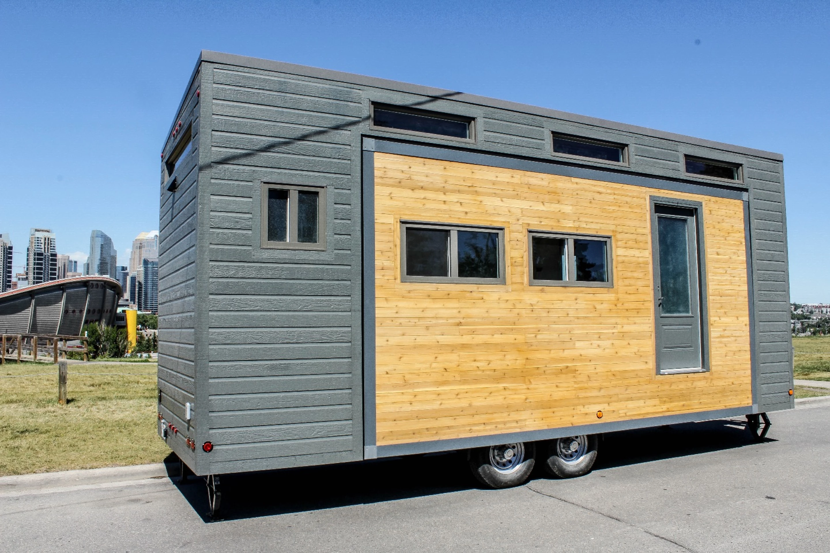 Compact tiny house expands in size to offer more living space
