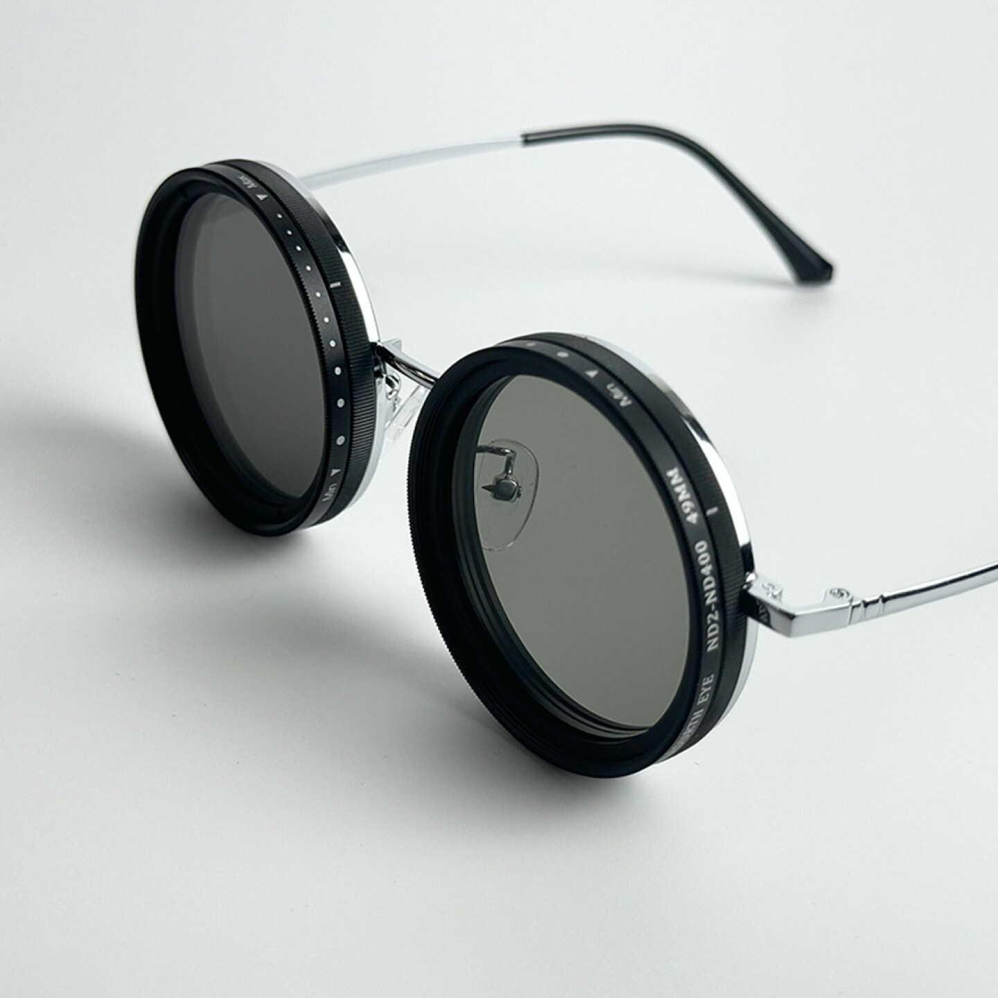 Adjustable-tint sunglasses use photographic filters as their lenses