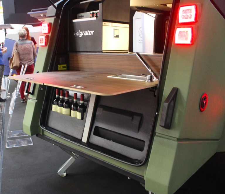 Gull-wing mini-caravan brings color and edge to the road less traveled