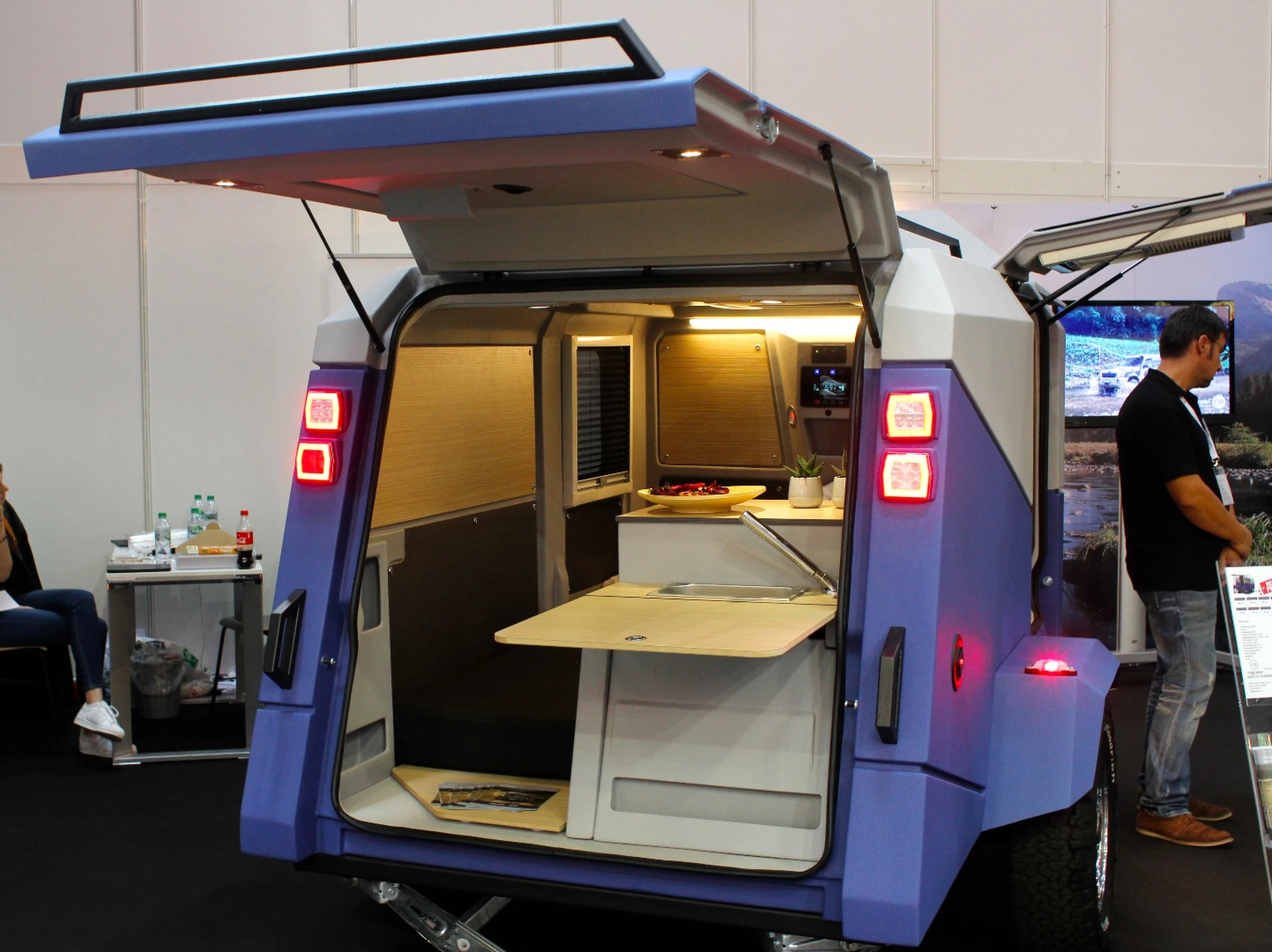 Gull-wing mini-caravan brings color and edge to the road less traveled