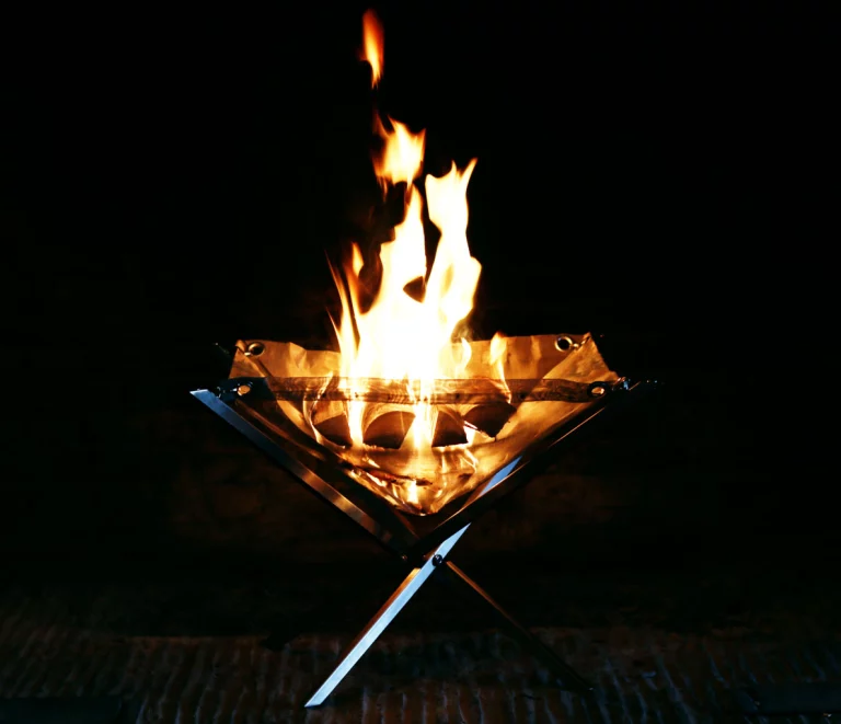 Rollable fire pit takes wood fire and grilling anywhere