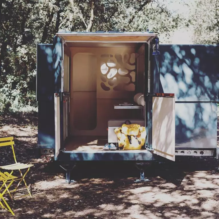 Sleek, compact camper pod grows to 3 times its size at the push of a button