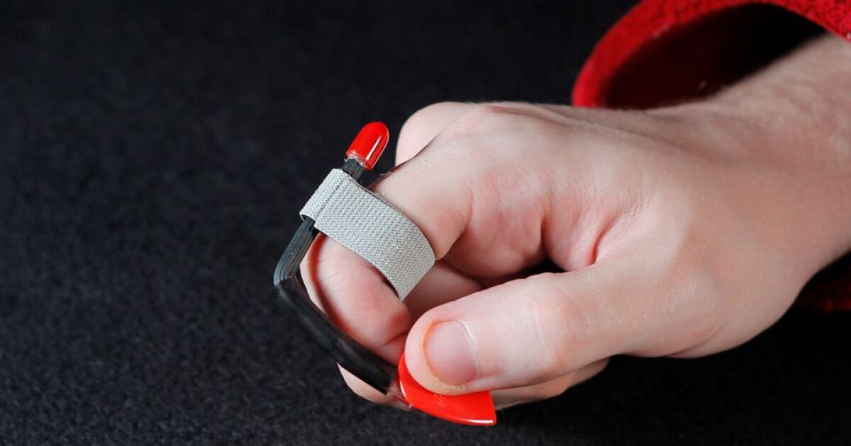 Pick holder flicks out of the way to let fingers get to work