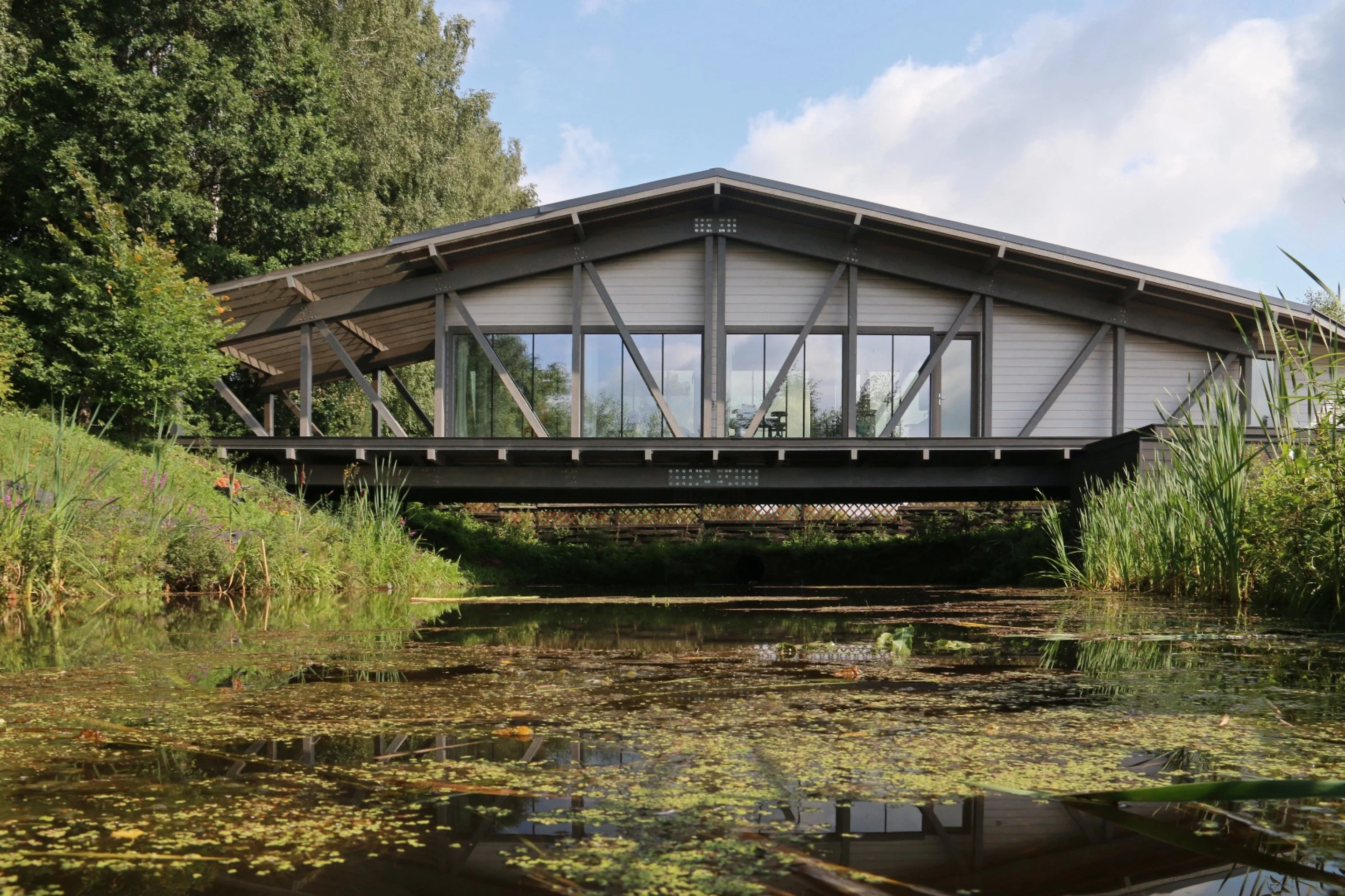 Winter-ready cabin spans small river in Russia