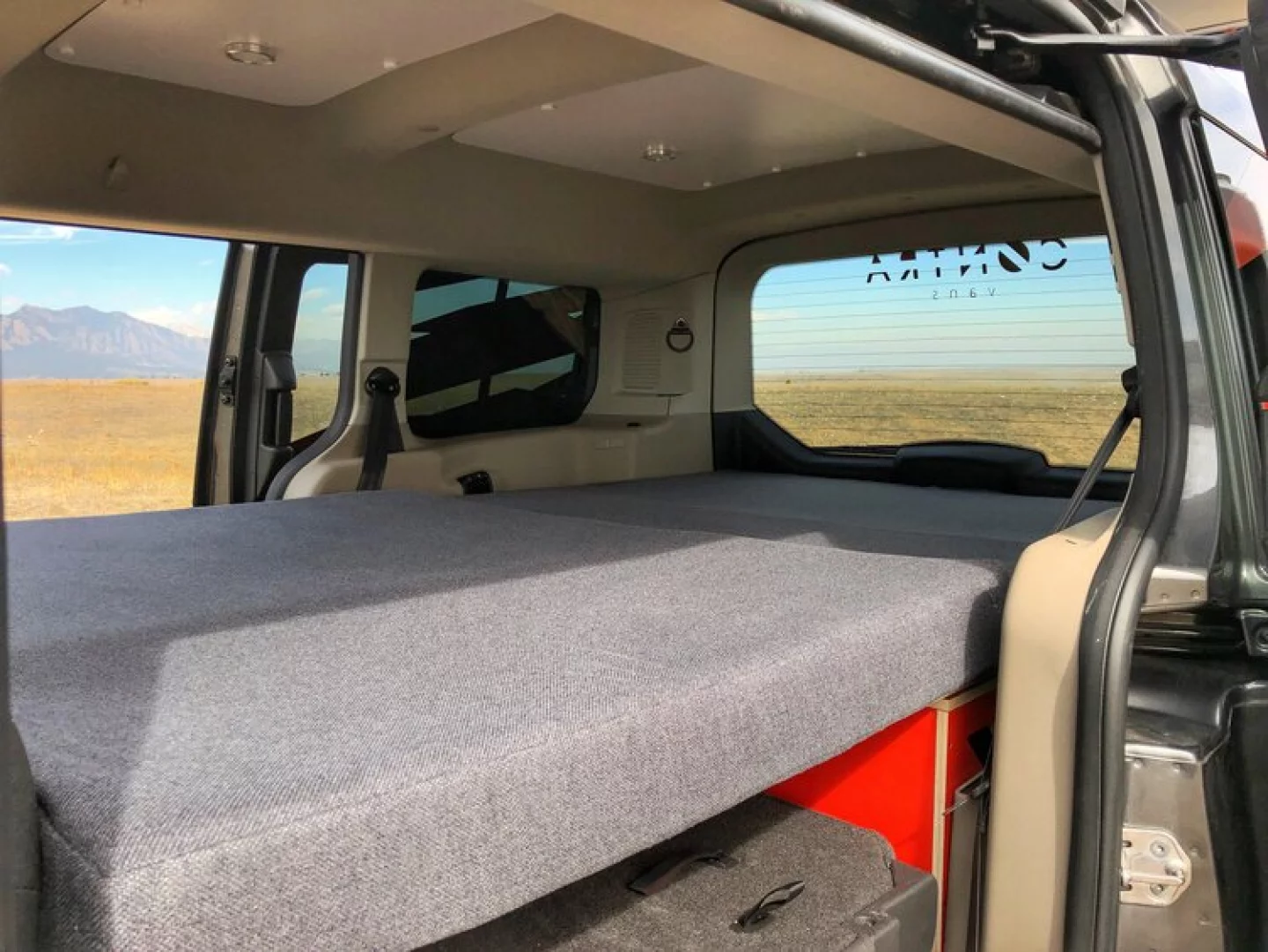 Fiery $35K+ Ford mini-campervan seats and sleeps a family of five