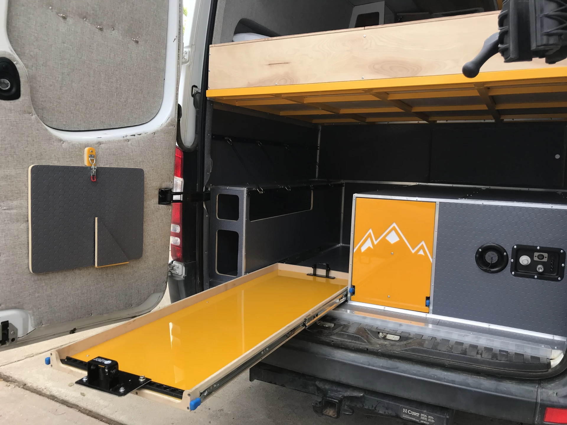 Ultimate gear head camper van clears space with foldaway bathroom