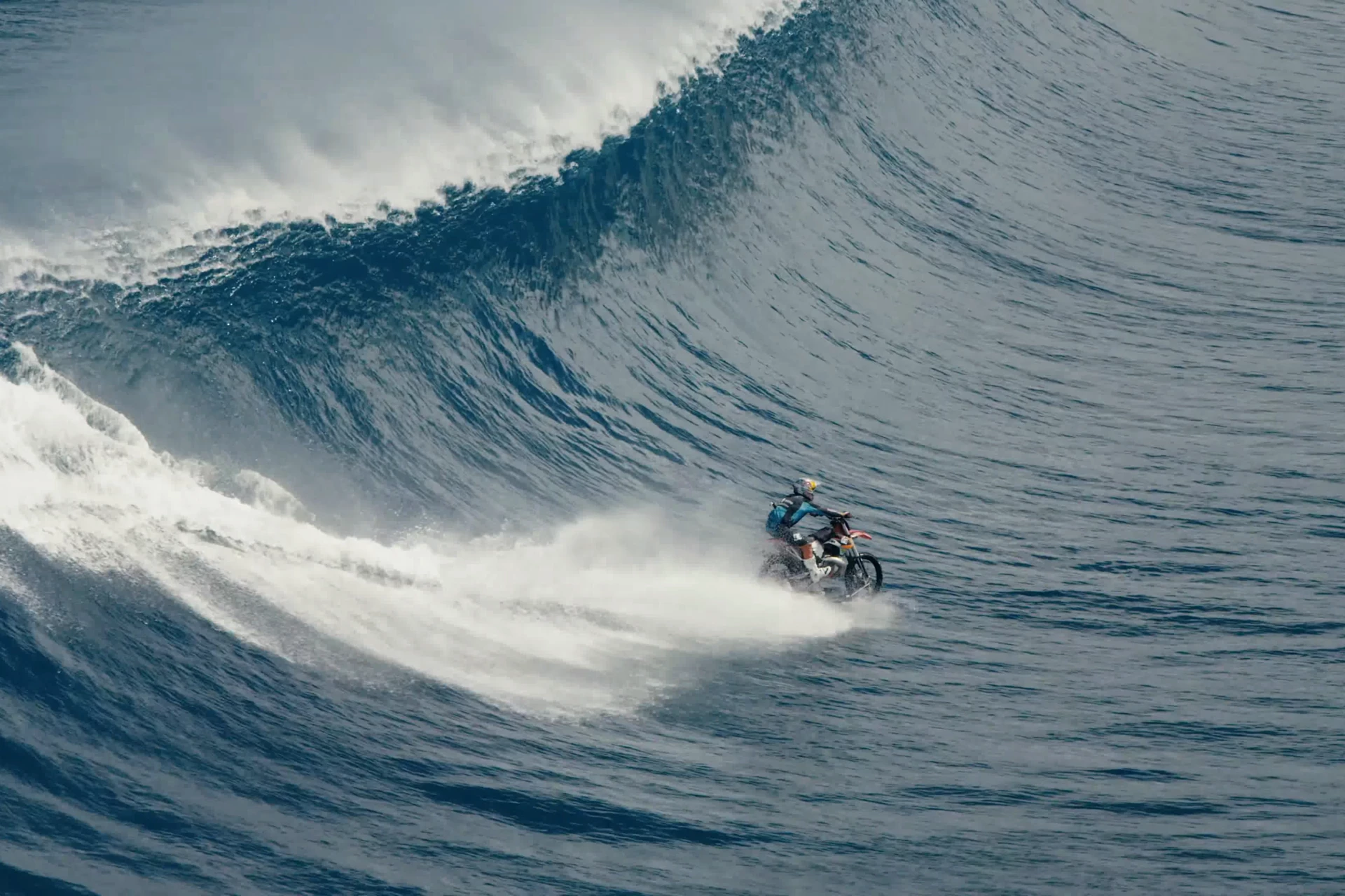 Daredevil Robbie Maddison surfs a huge wave ... on a motorbike