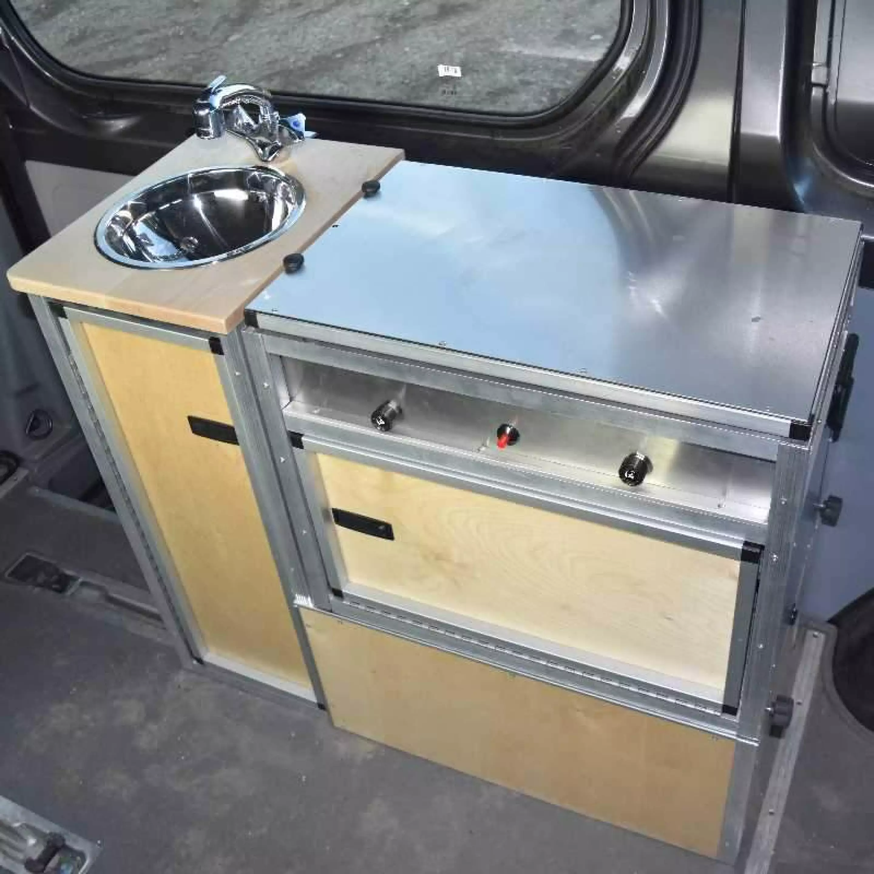 Plug-n-play indoor/outdoor TK kitchen instantly turns van into camper van