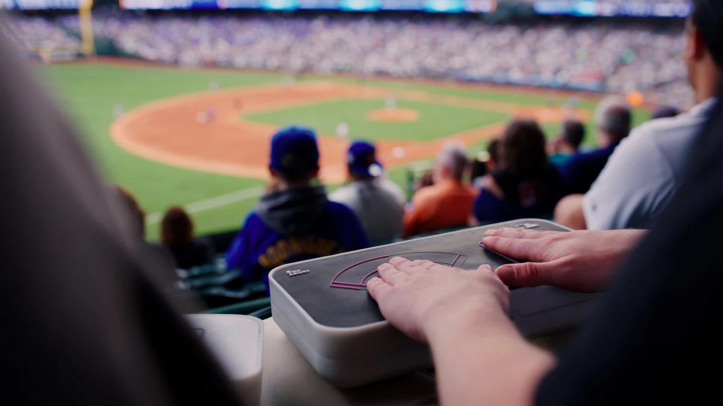 Braille for sports: Haptic handheld broadcasts games to your fingertips
