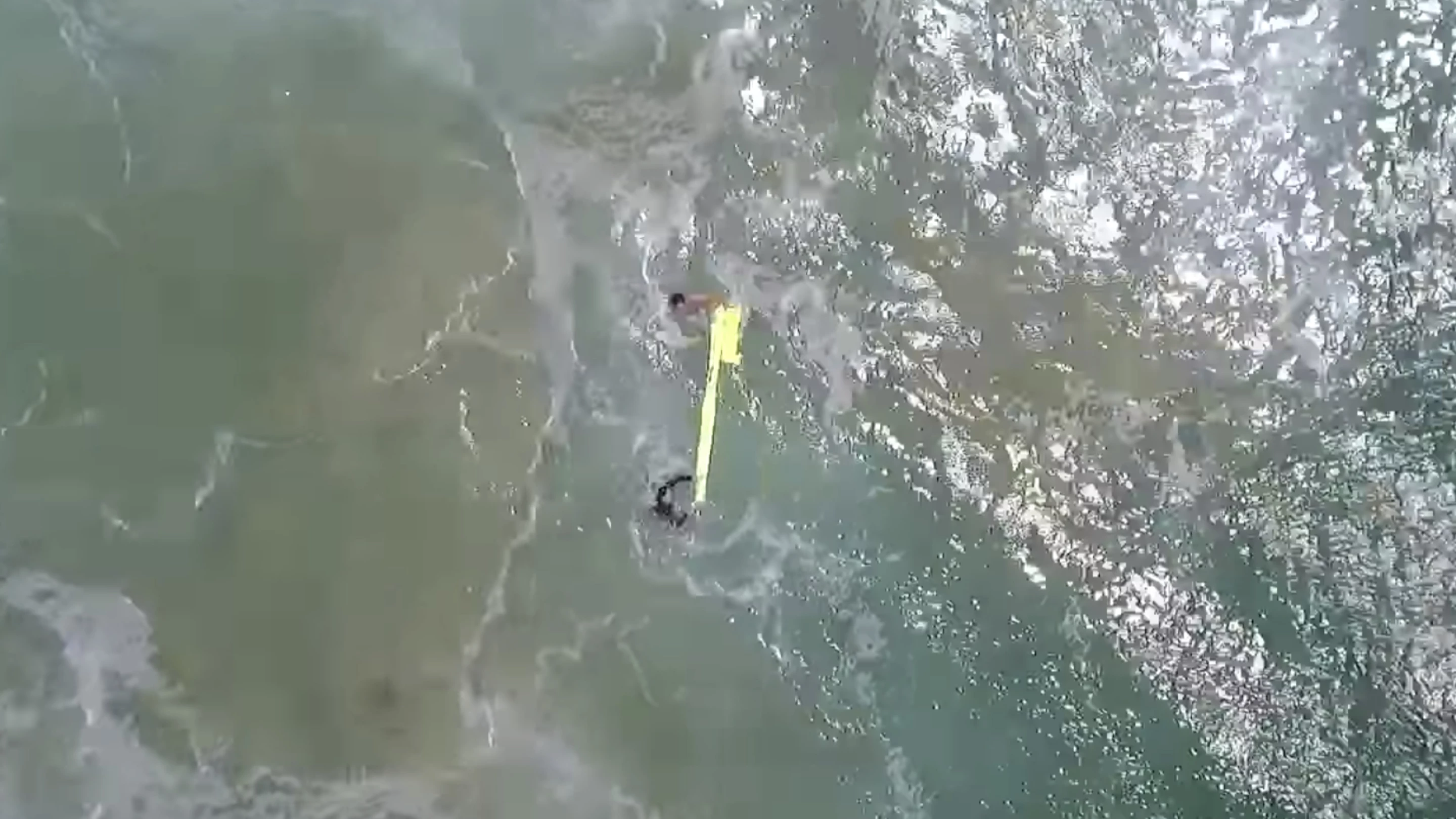 Drone drops flotation device to stranded swimmers in world-first rescue ...