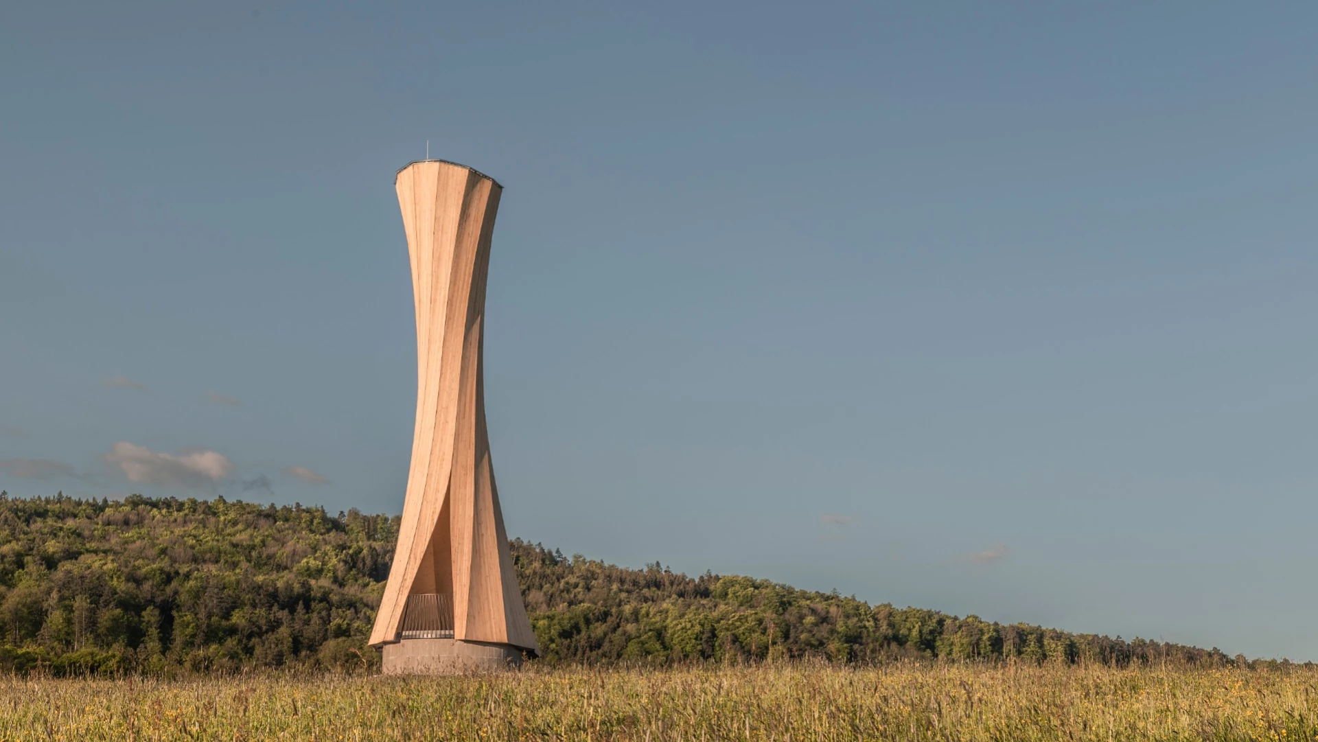 "World-first" twisting tower is made from timber that bends itself into ...