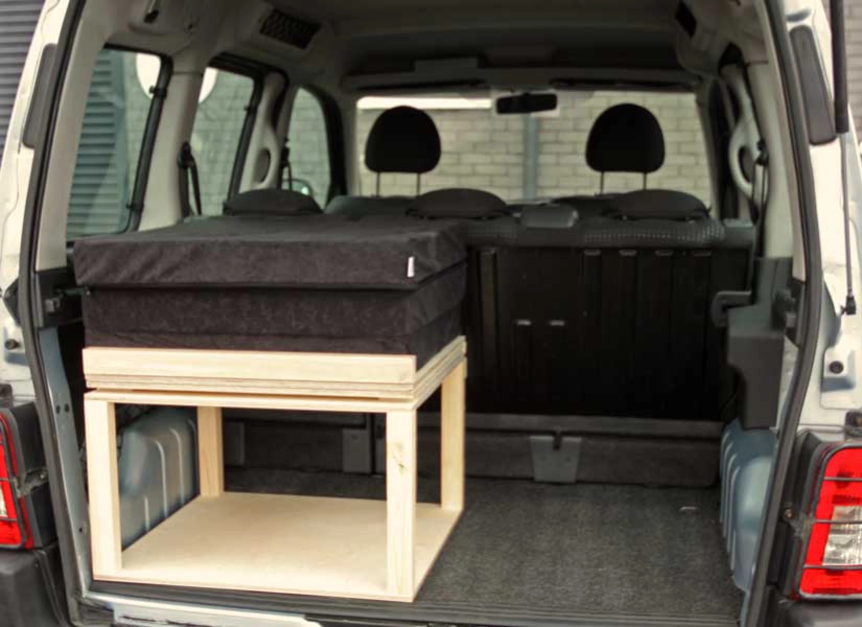 Simple kit turns small vans or crossovers into cozy micro campervans ...