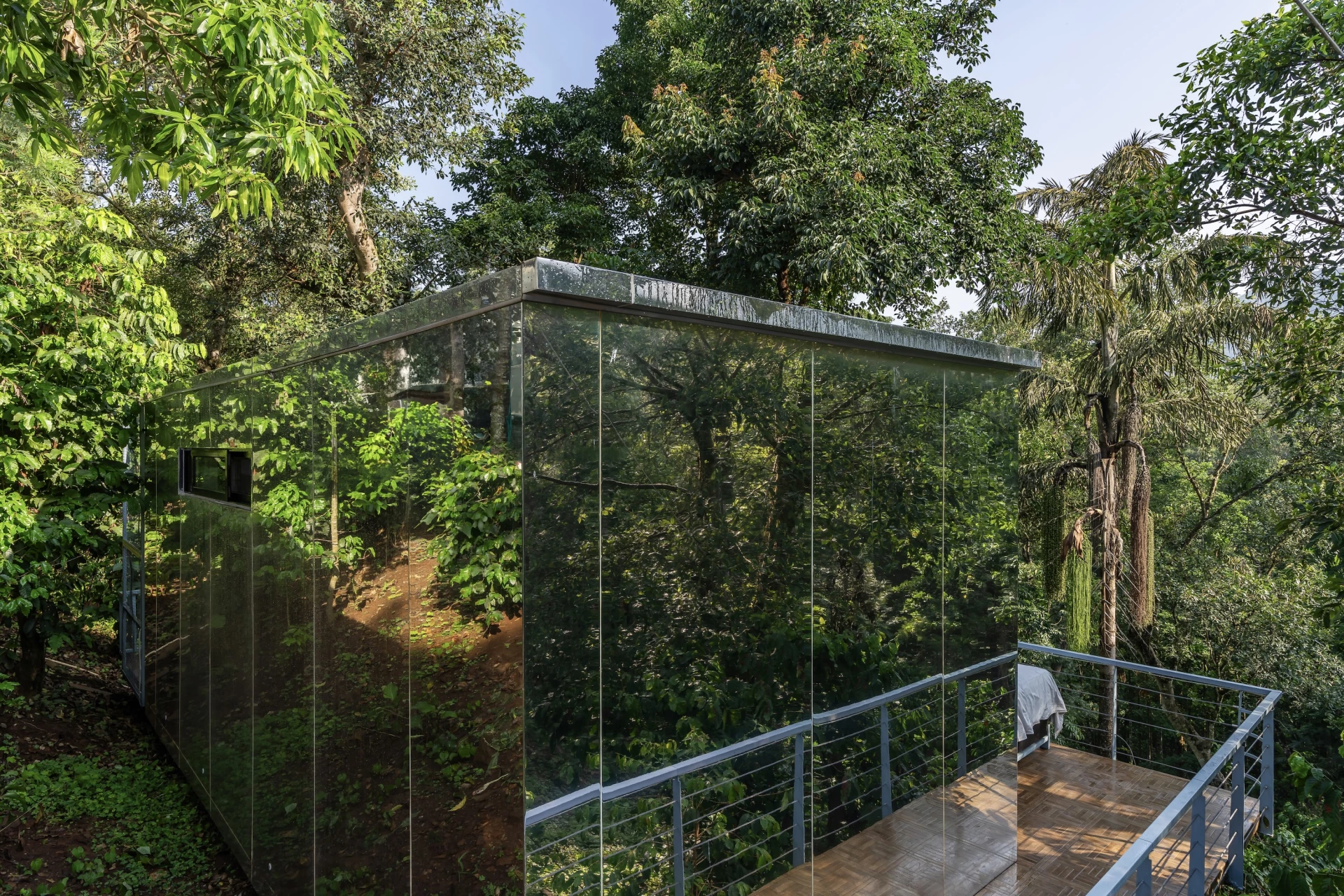 Mirrored tiny house slides out its bed so owners can sleep under the stars