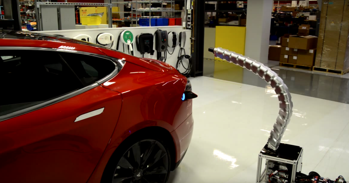Tesla's serpentine robotic charger snakes its way into a Model S