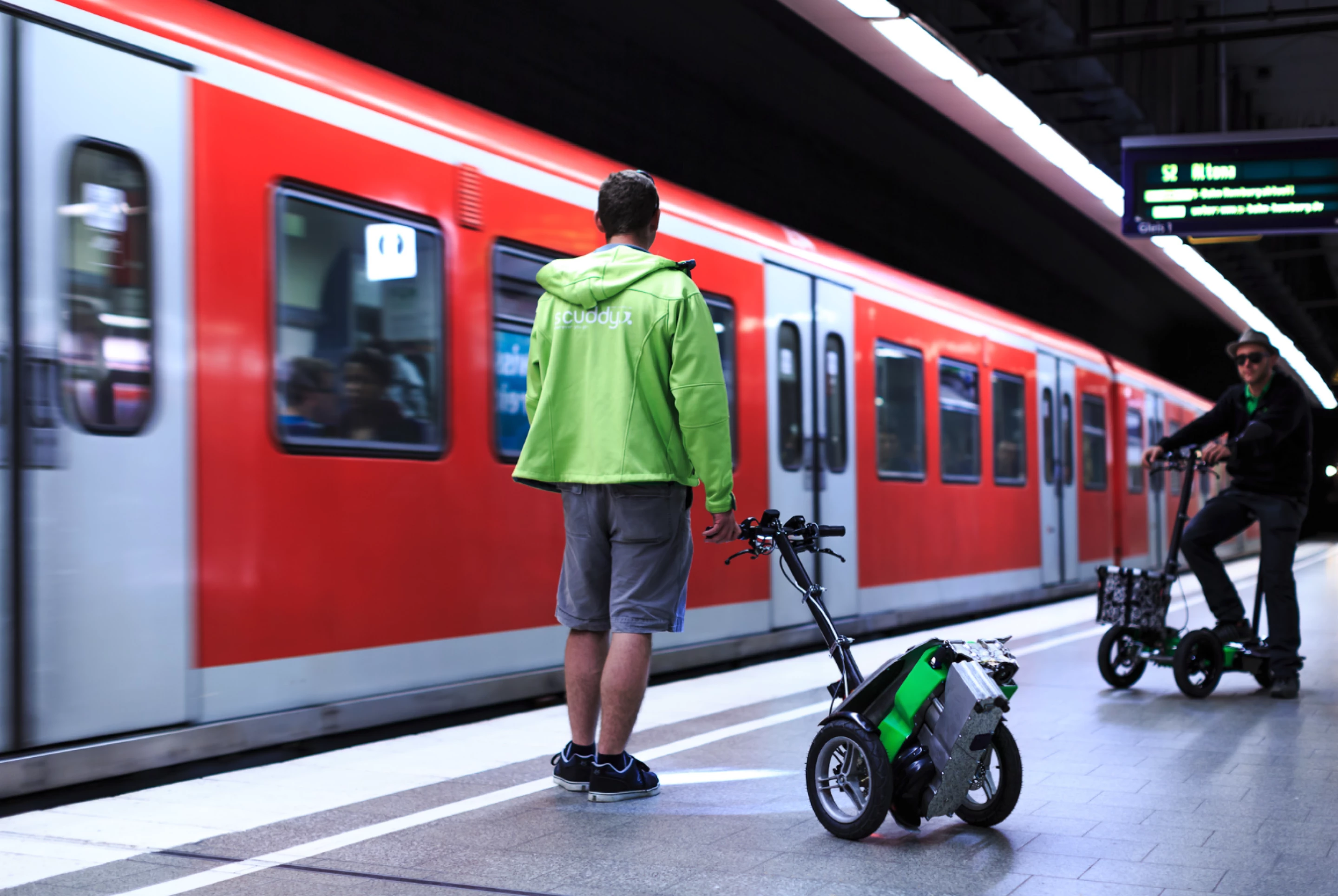 The Scuddy electric folding scooter stands up, sits down and trolleys