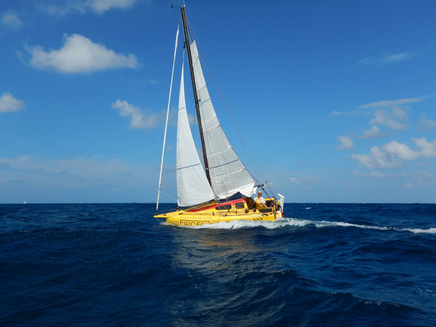Solar-assisted, volcanic-composite sailing yacht navigating world's ...