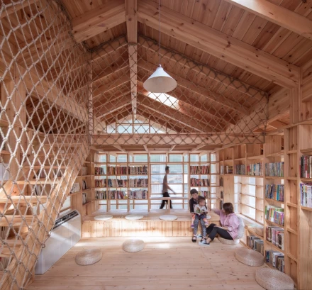 Elevated library glows invitingly in rural China