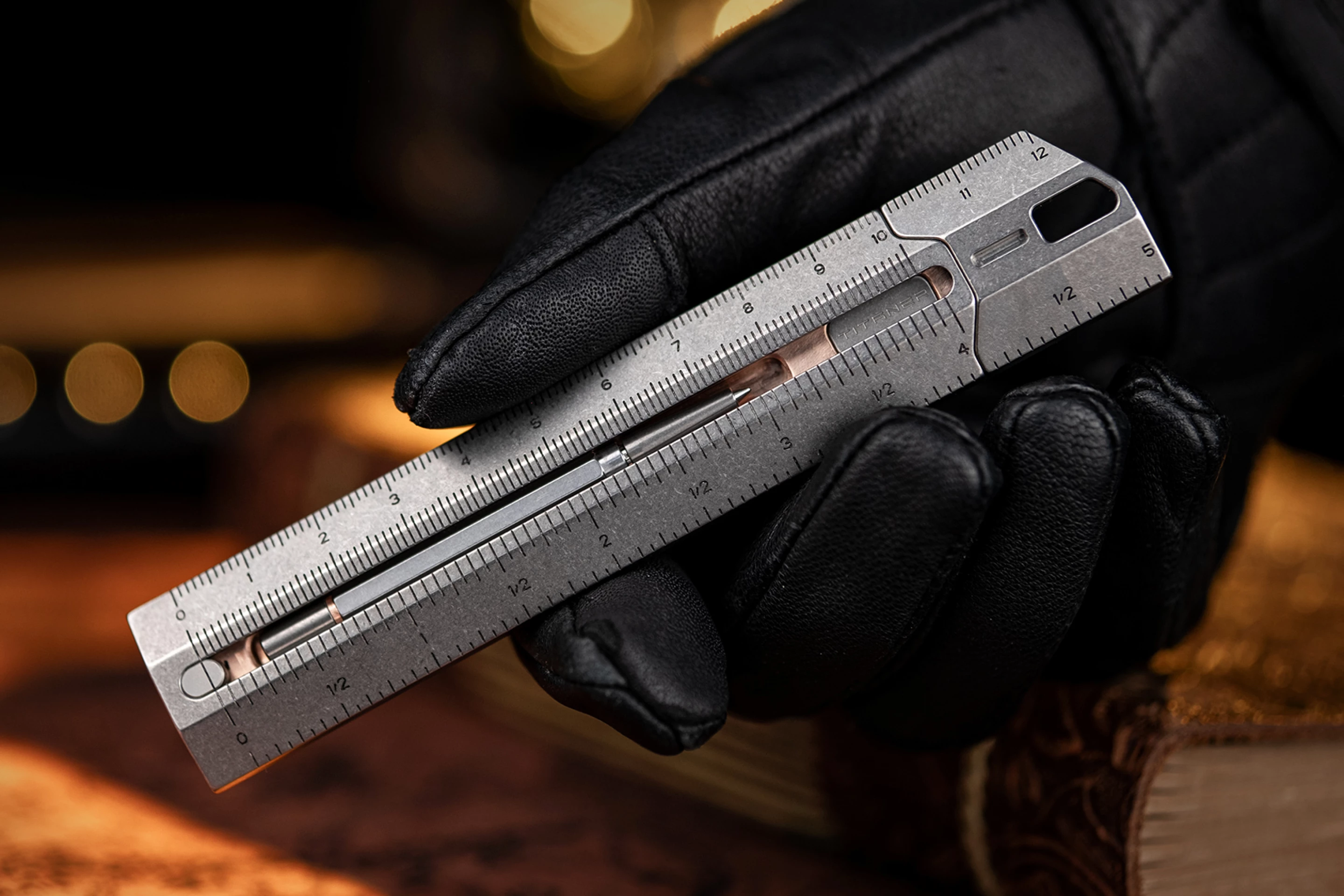 Brainy extendable titanium ruler packs a caliper, pen and slide rule