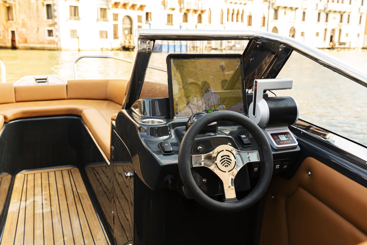 Slick, small Wave e-550 electric boat surges onto open water