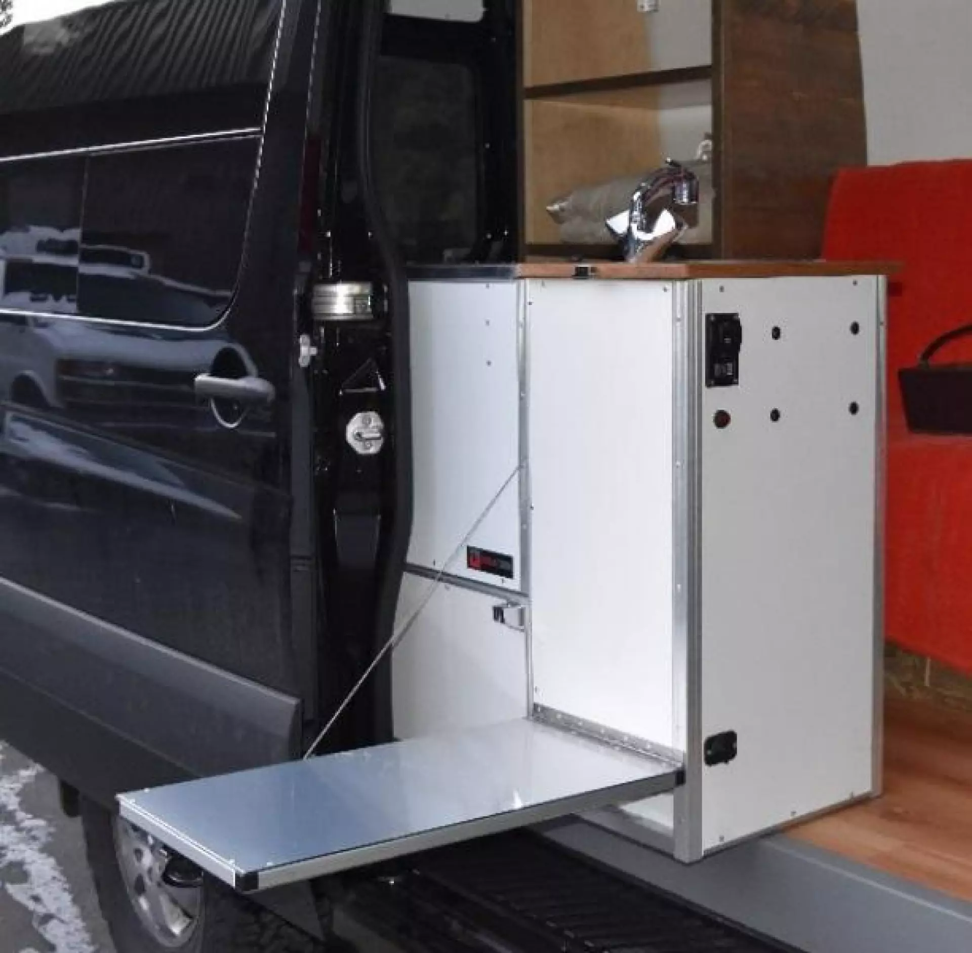 Plug-n-play indoor/outdoor TK kitchen instantly turns van into camper van