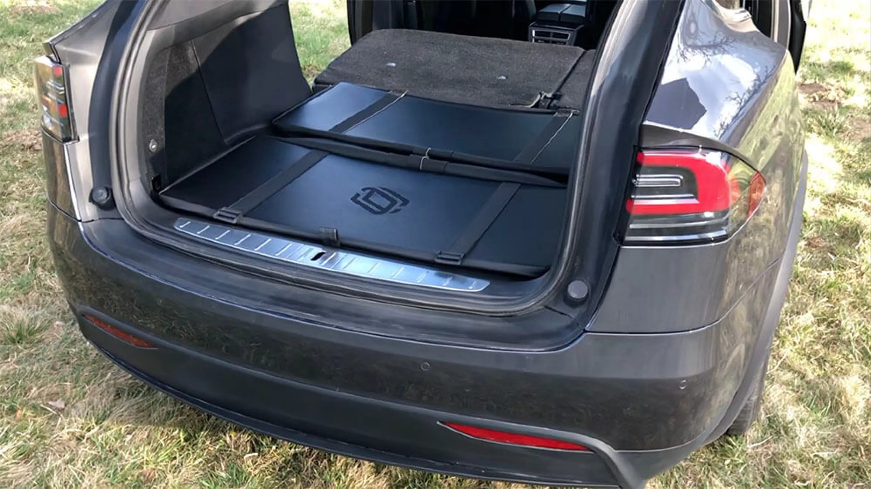 Dreamcase auto bed turns a Tesla into an electrified mini-campervan