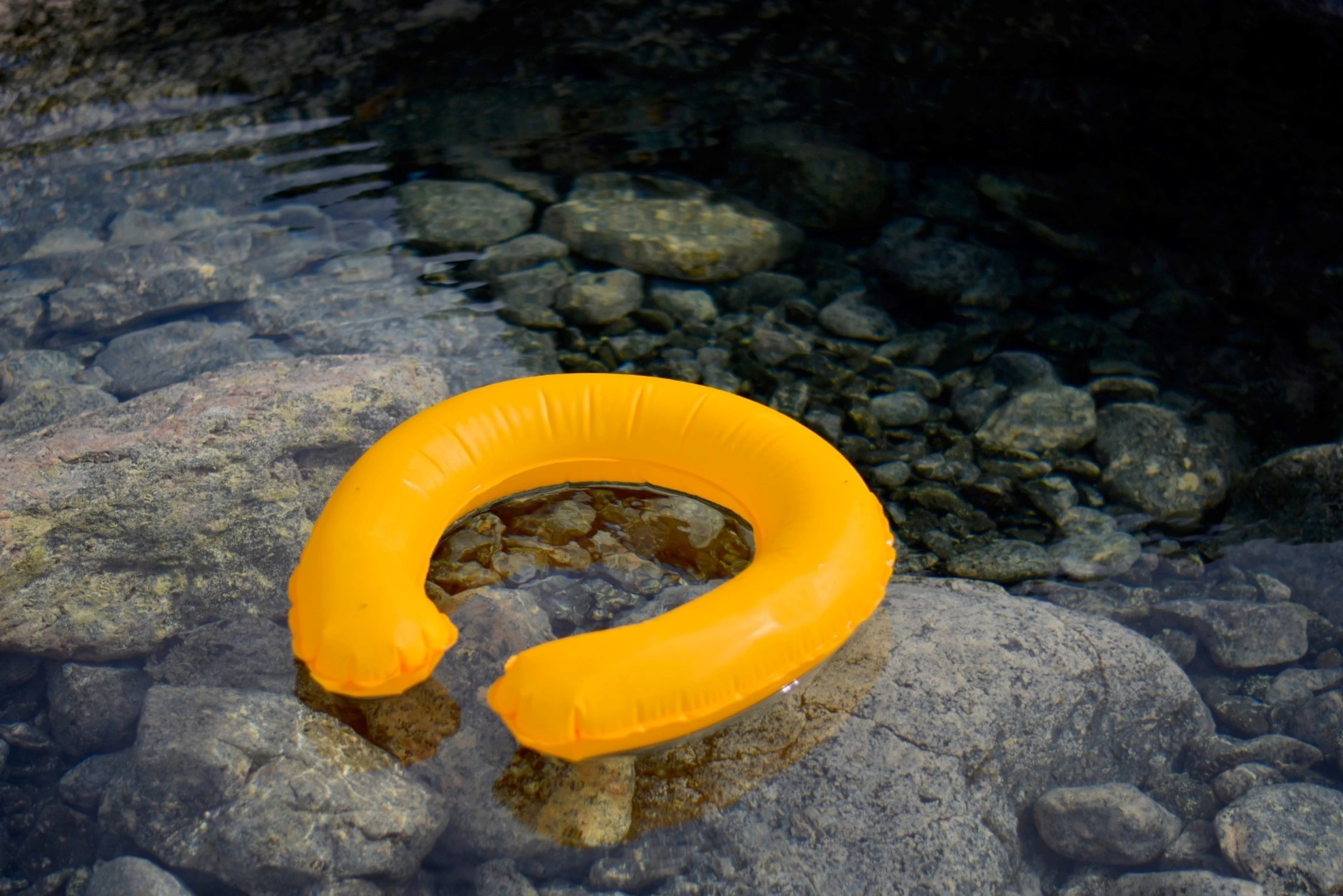 Compact life preserver blows up when it hits the water