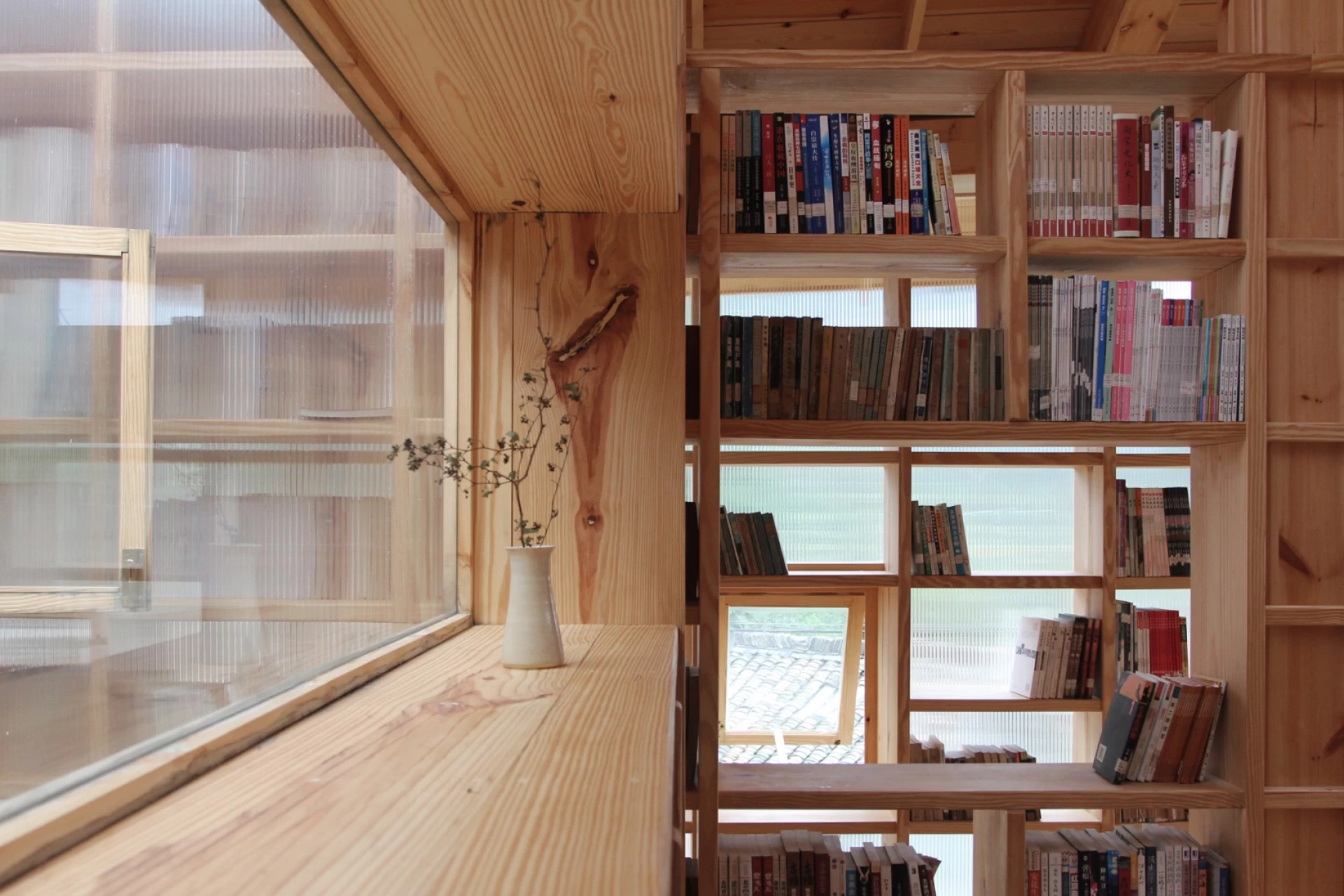 Elevated library glows invitingly in rural China