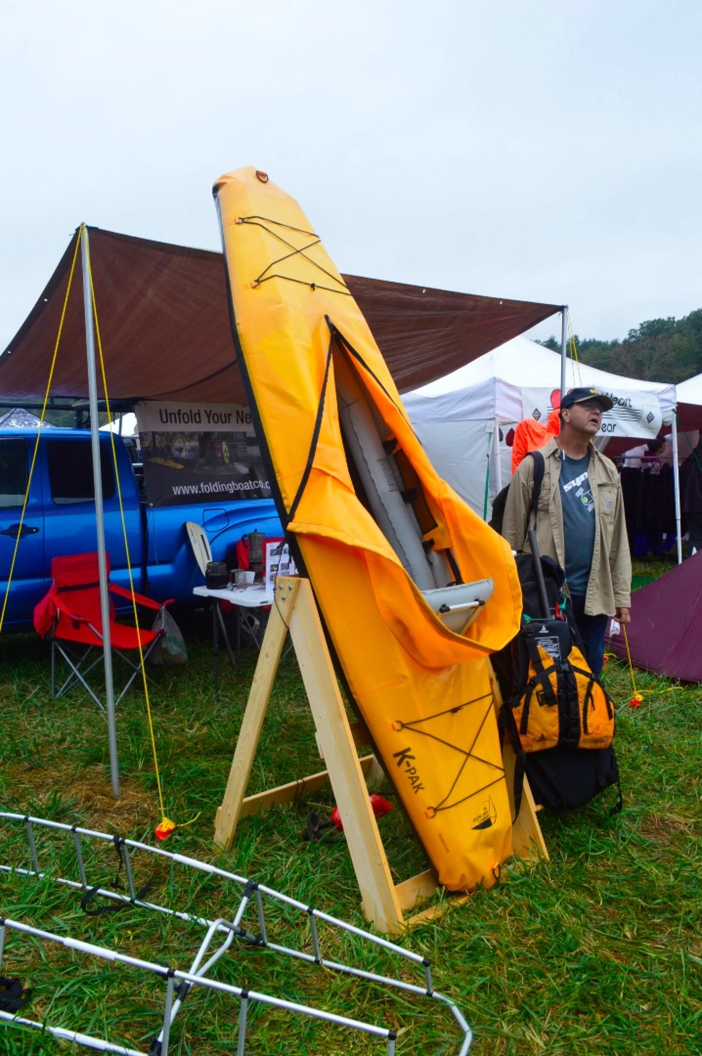 Backpackable boat unfolds and inflates into paddling form