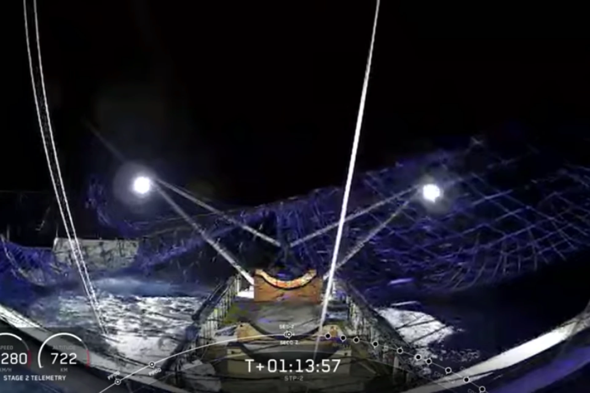 SpaceX catches a falling piece of rocket with a giant net