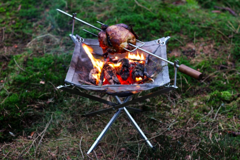 Rollable fire pit takes wood fire and grilling anywhere