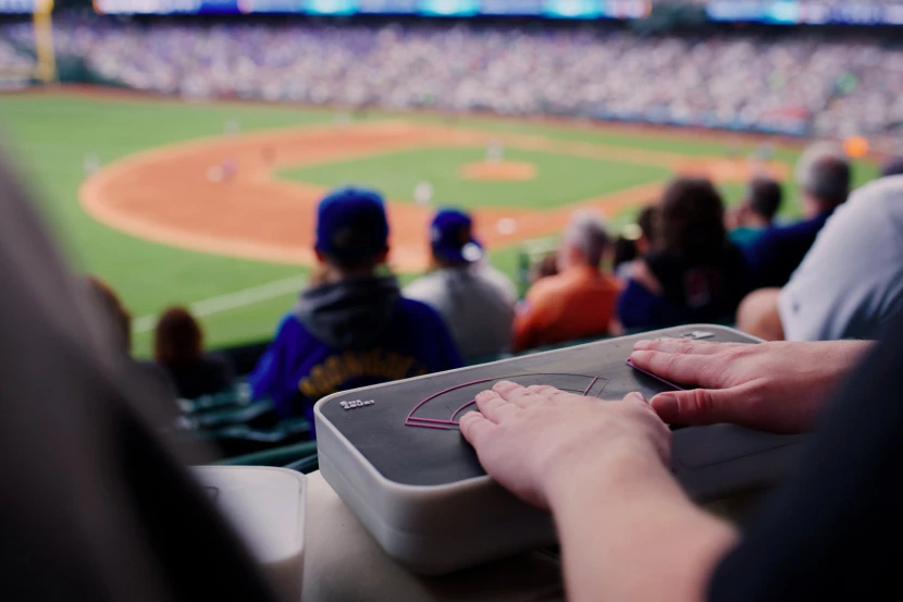 Braille for sports: Haptic handheld broadcasts games to your fingertips