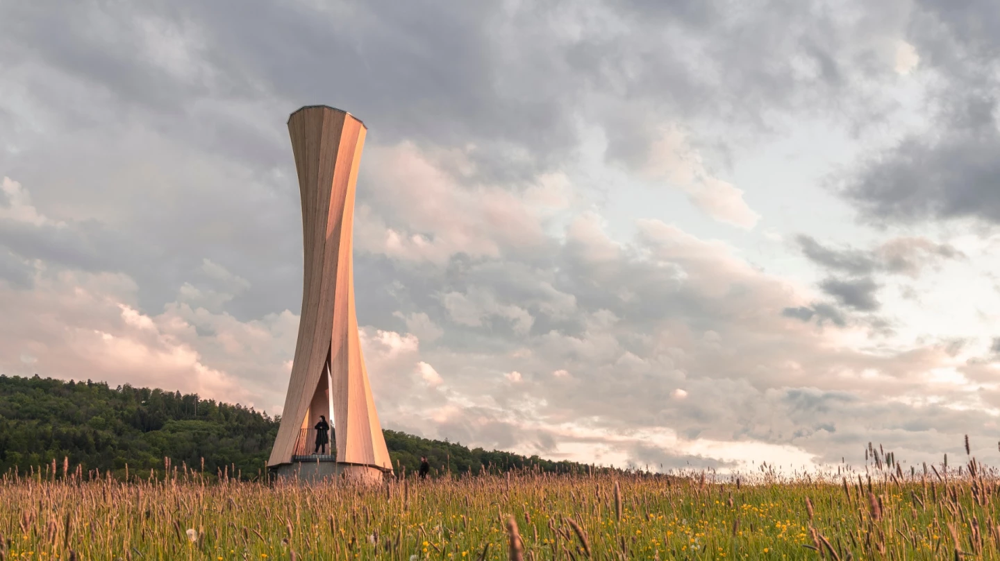 "World-first" twisting tower is made from timber that bends itself into ...