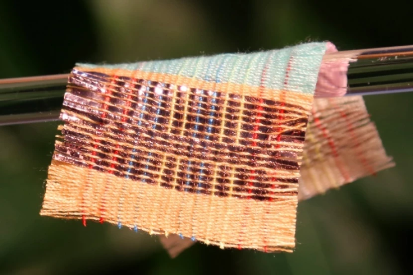 Power-generating fabric harvests energy from sunlight and movement