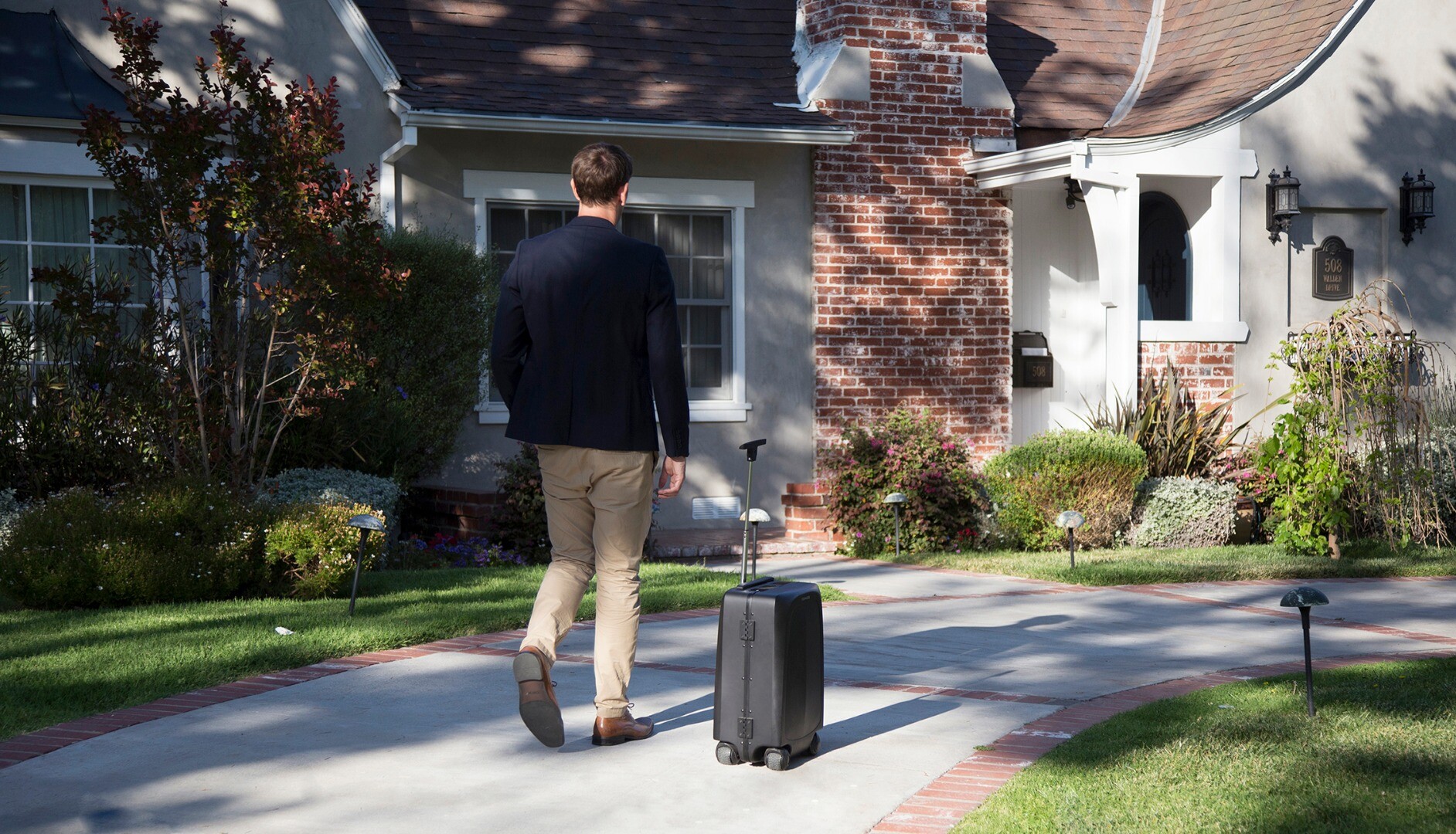 Motorized AI-packin' suitcase keeps its eyes on its owner