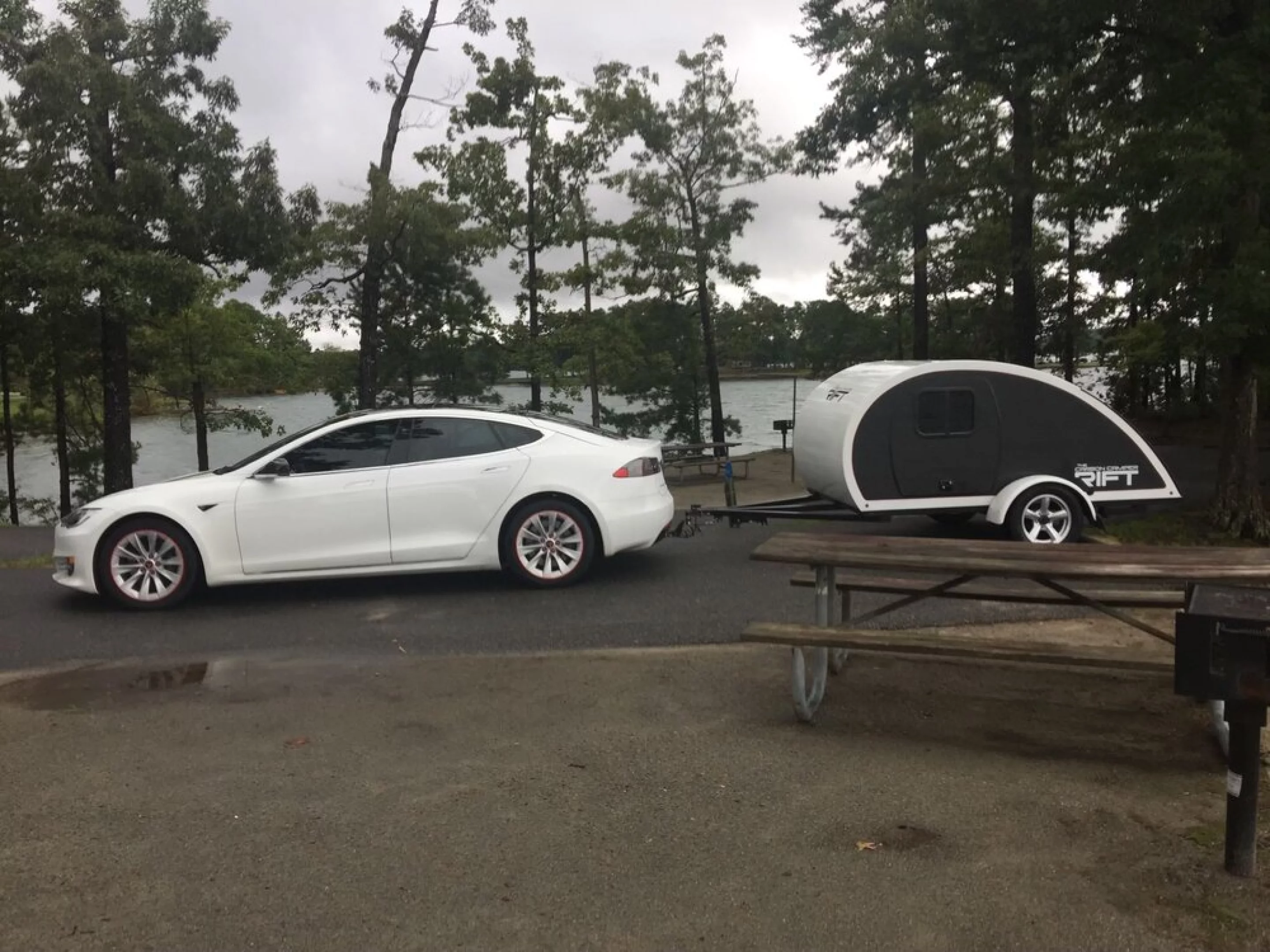 Ultralight carbon teardrop utility camper tows via EV or motorcycle