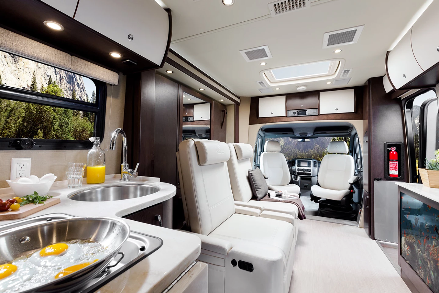 Unity motorhome combines Murphy bed and swivel recliners in comfy ...