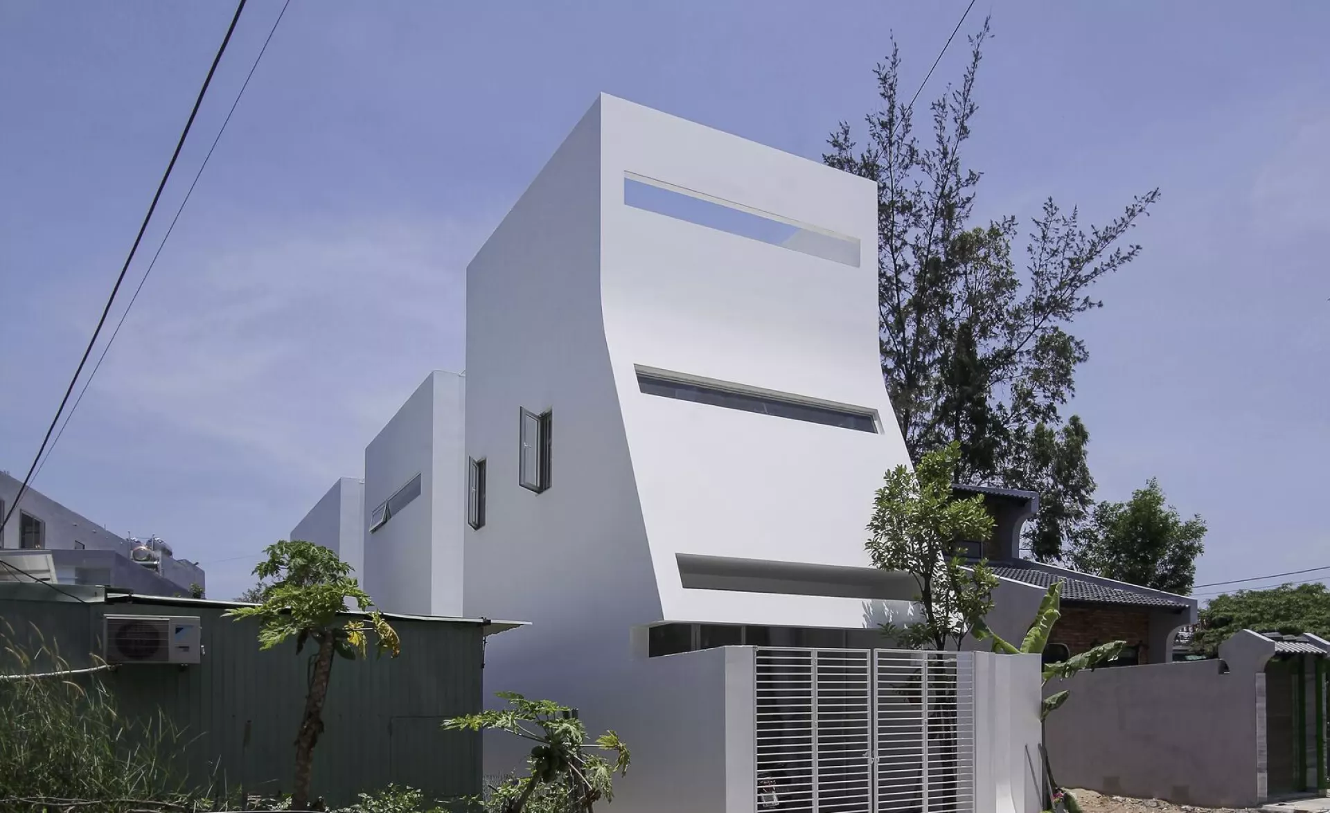 Family home in Vietnam boasts curved facade for passive air flow