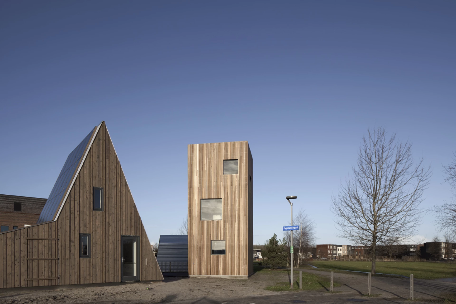 Skinny house is smaller than a couple of parking spaces